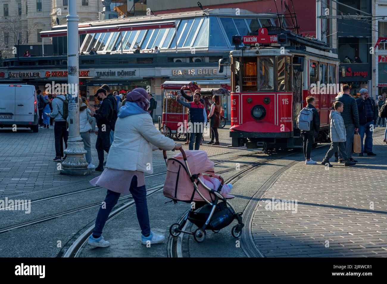 ISTANBUL, TURKEY - January 2022: Retro tram moves along a busy Istiklal ...