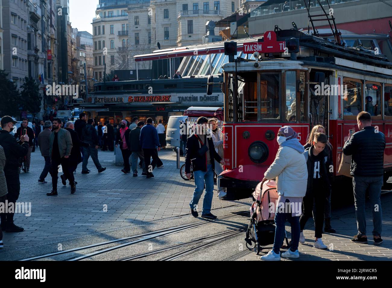 ISTANBUL, TURKEY - January 2022: Retro tram moves along a busy Istiklal ...