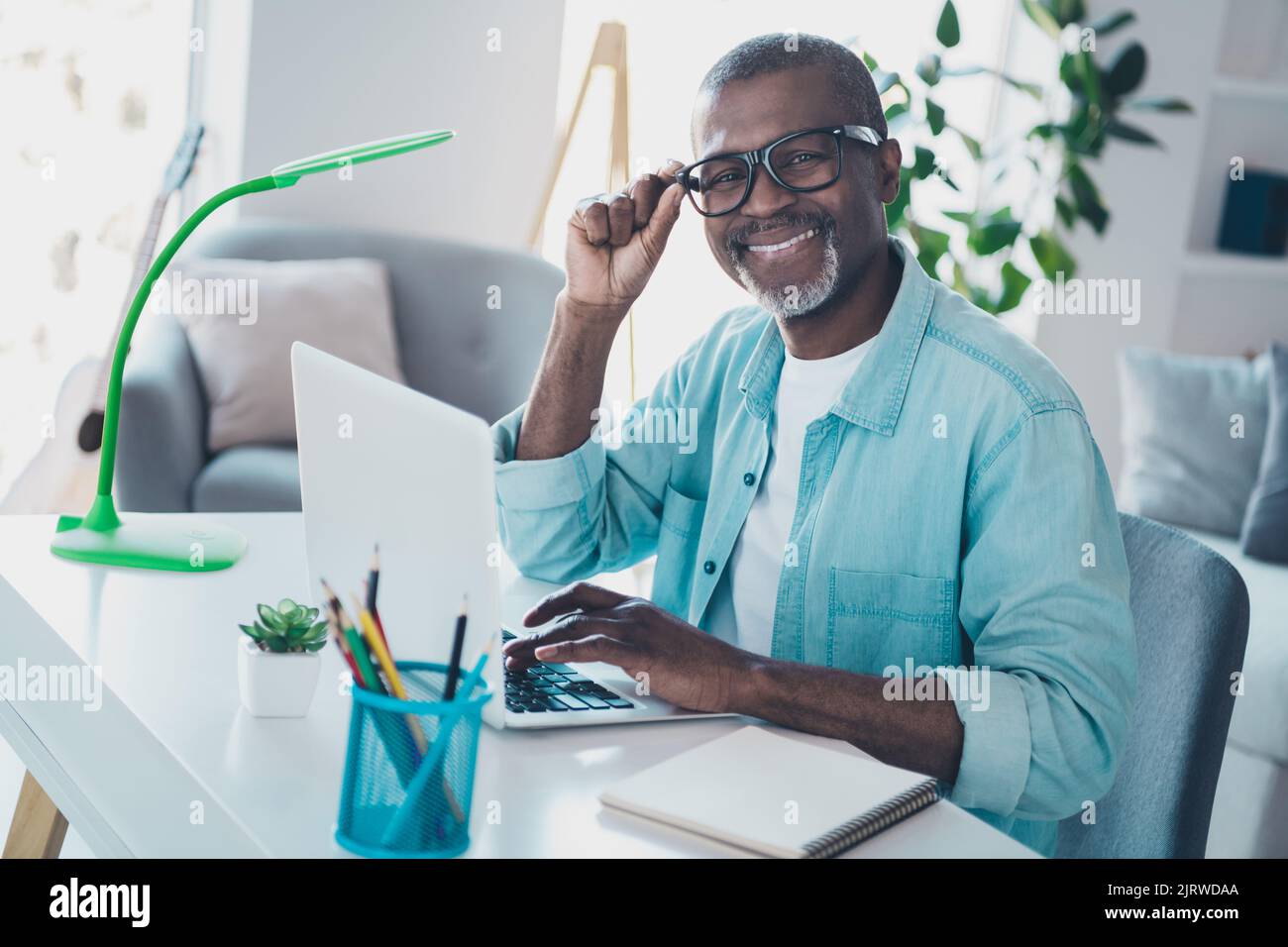 Photo of positive skilled programmer man working on new project start ...