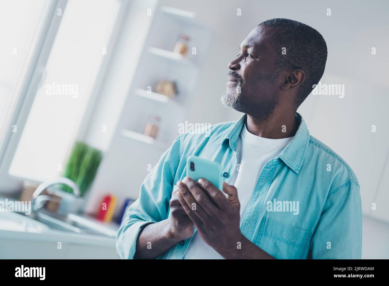 Photo of minded aged man use modern technology imagine social network ...