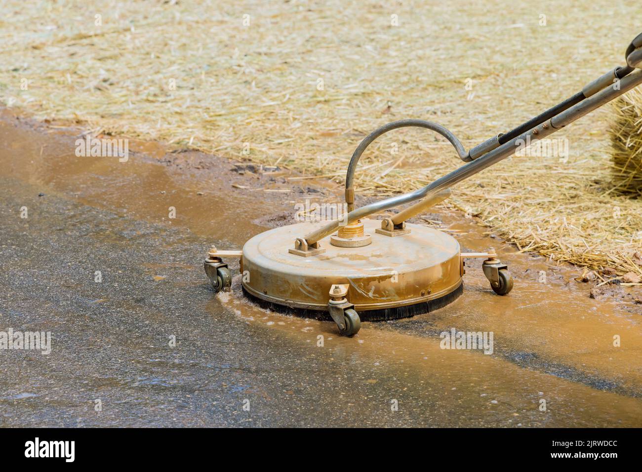 During the process of cleaning the road, the worker used sweeper ...