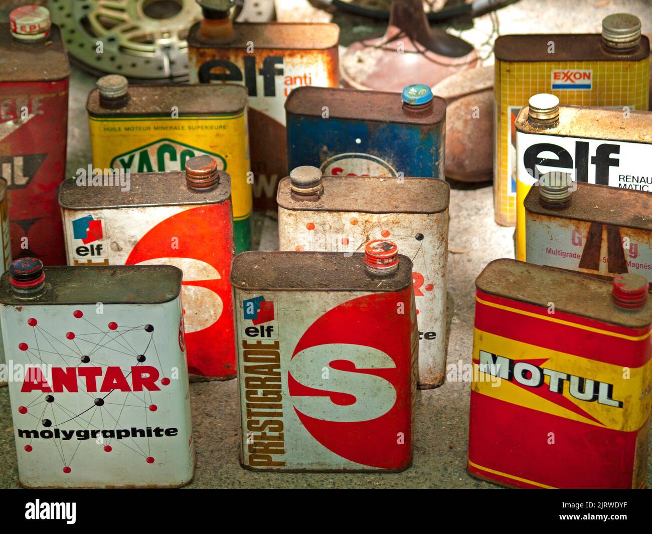 Tins of engine oil for sale at the market in Saint-Chinian, Languedoc ...