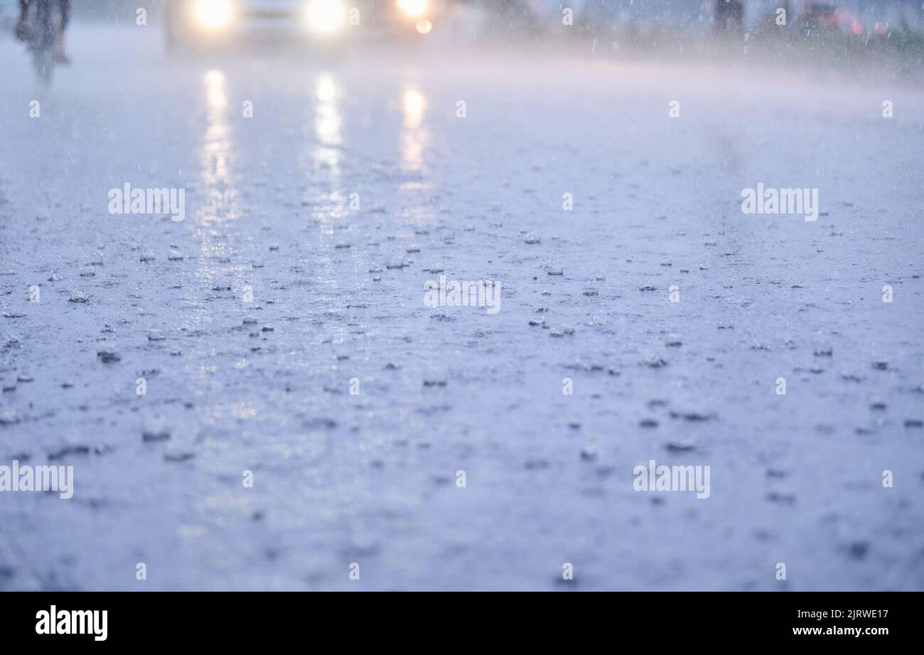 Berlin, Germany. 26th Aug, 2022. Cars drive through deep puddles that ...