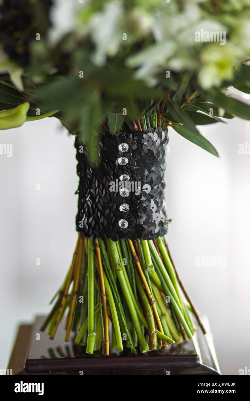 Wedding bouquet stem wrapped with fabric ribbon Stock Photo - Alamy