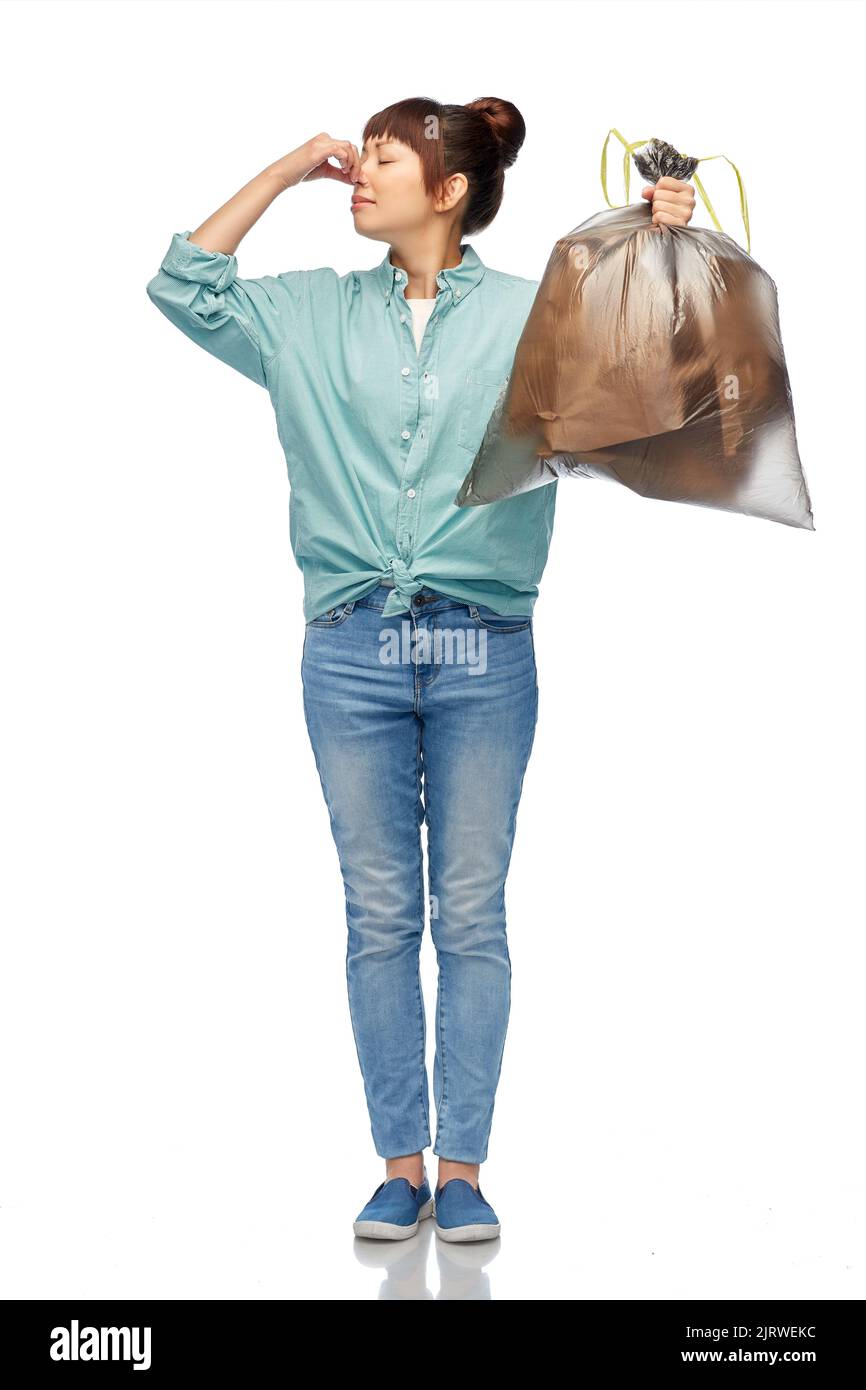 asian woman holding smelly trash in plastic bag Stock Photo - Alamy