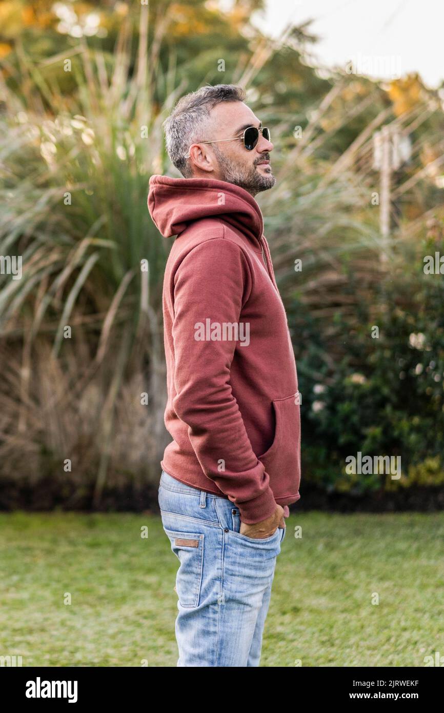 Side view of a handsome man in a hoodie Stock Photo - Alamy