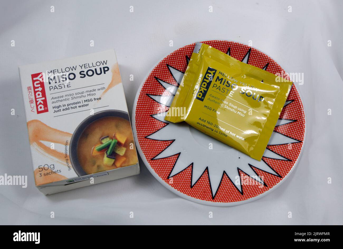 Miso soup box and sachet on a pretty psaucer. Studio set up Stock Photo ...