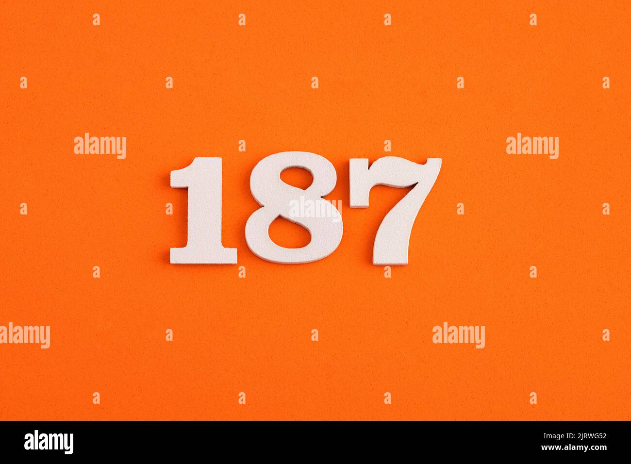 Number 187 - On orange foam rubber background Stock Photo - Alamy
