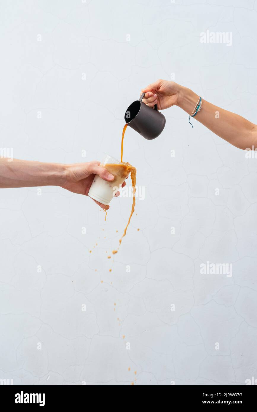 Womans hand pouring coffee hi-res stock photography and images - Alamy