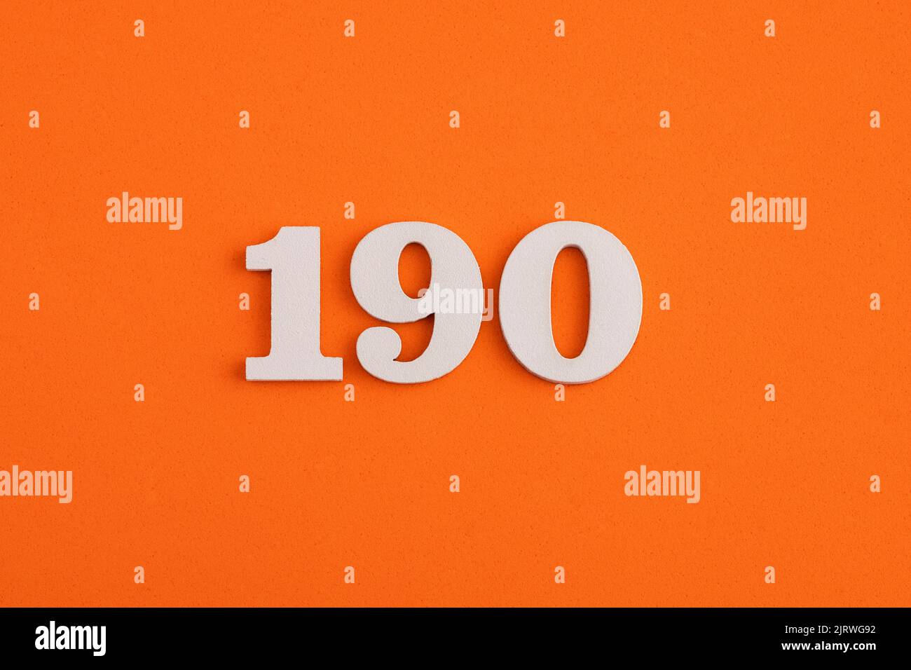 White wooden number 190 on eva rubber orange background Stock Photo - Alamy