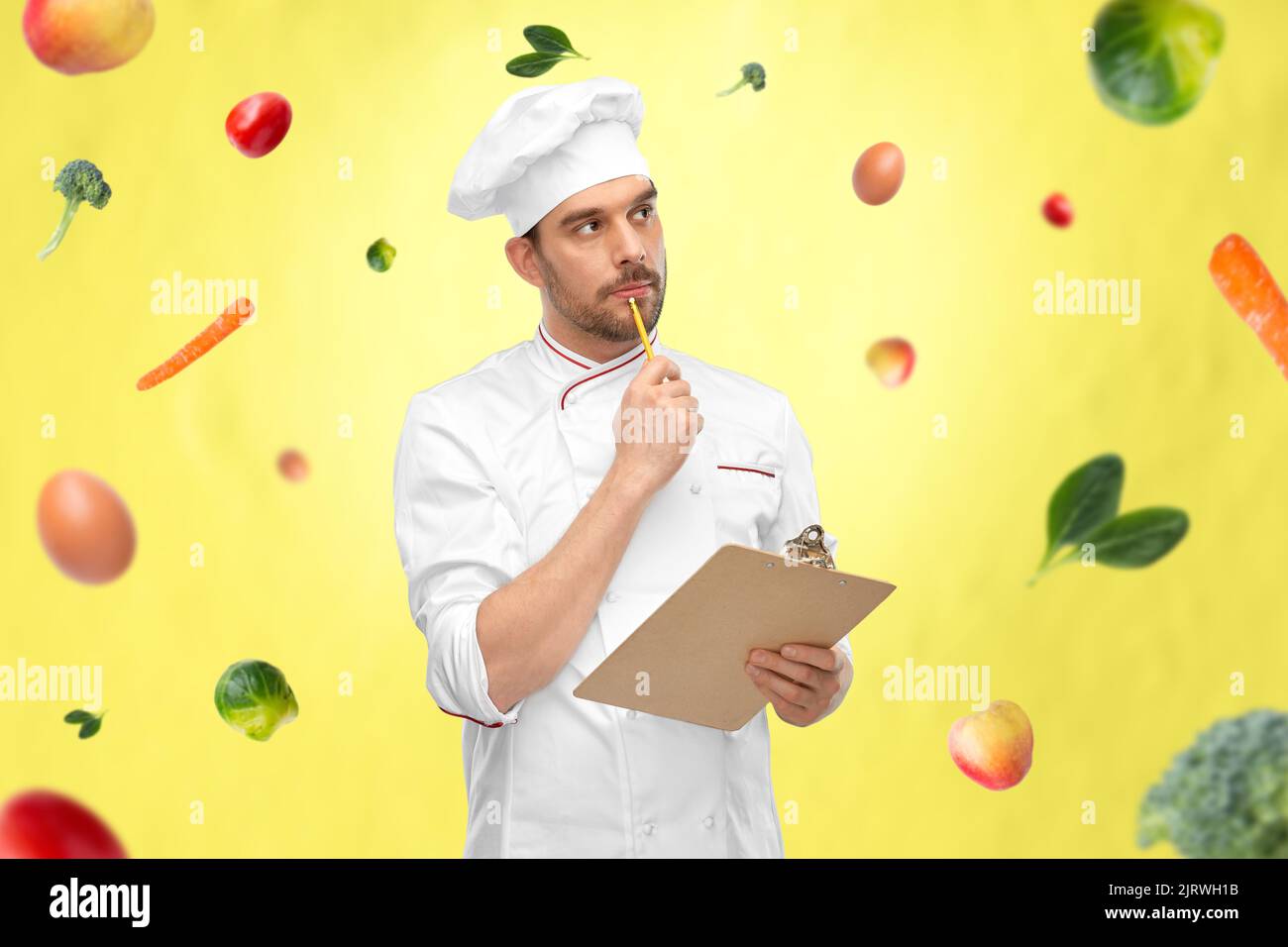 thinking male chef with clipboard Stock Photo - Alamy