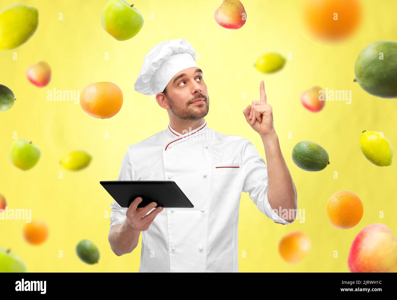 male chef with tablet computer pointing finger up Stock Photo - Alamy