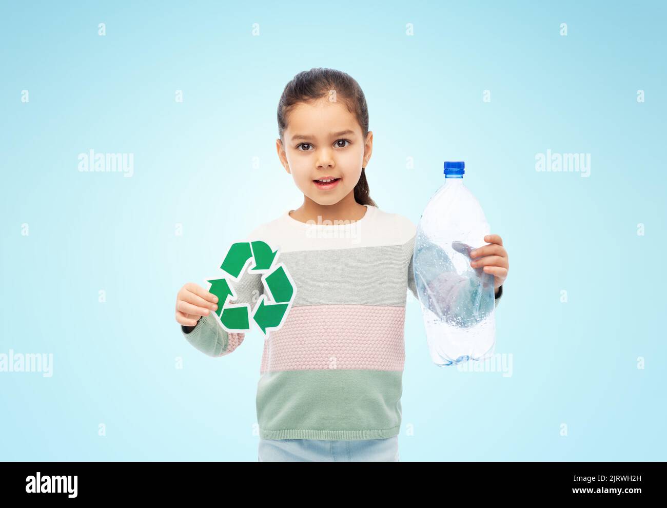 girl with green recycling sign and plastic bottle Stock Photo - Alamy