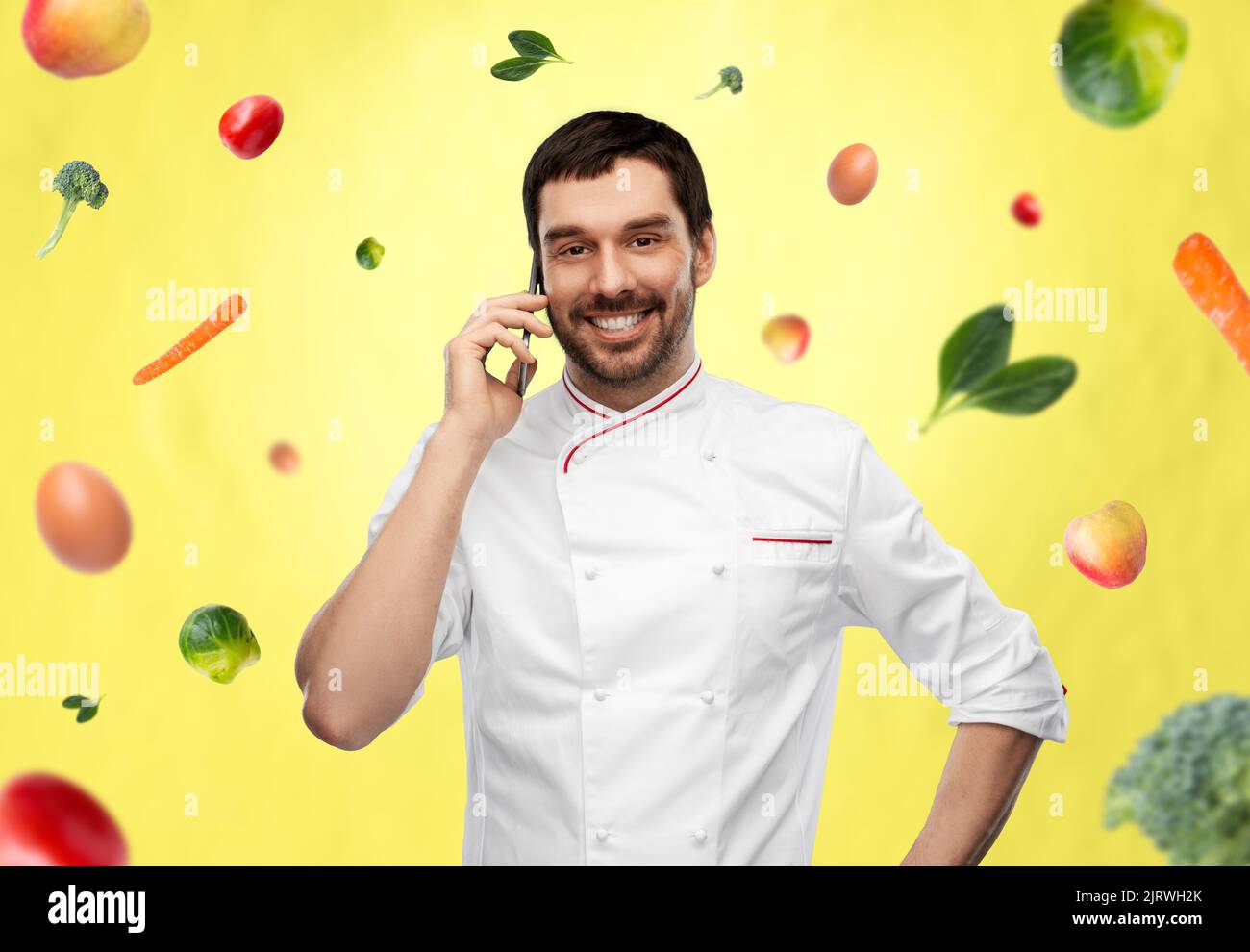 happy smiling male chef calling on smartphone Stock Photo - Alamy