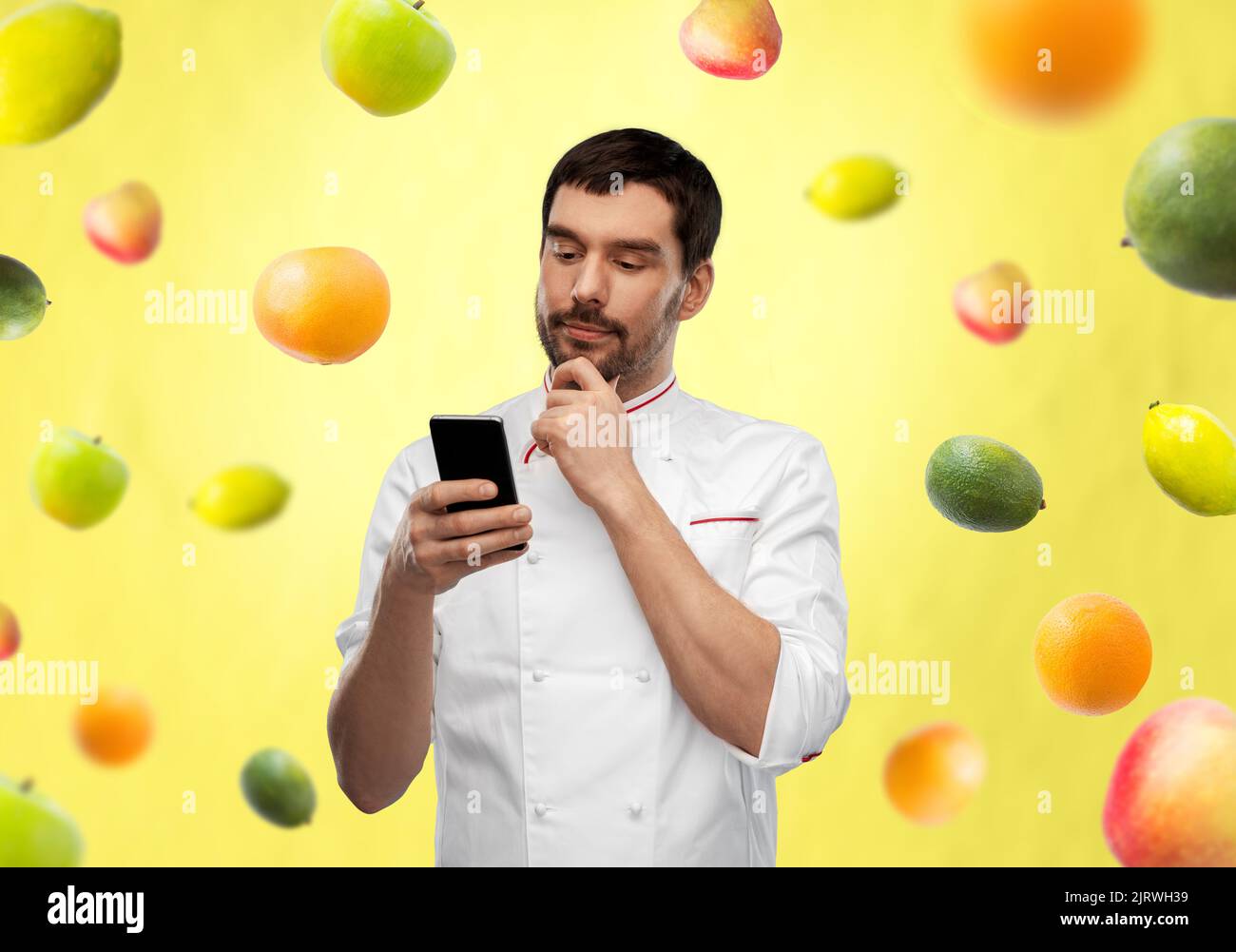 thinking male chef with smartphone Stock Photo - Alamy