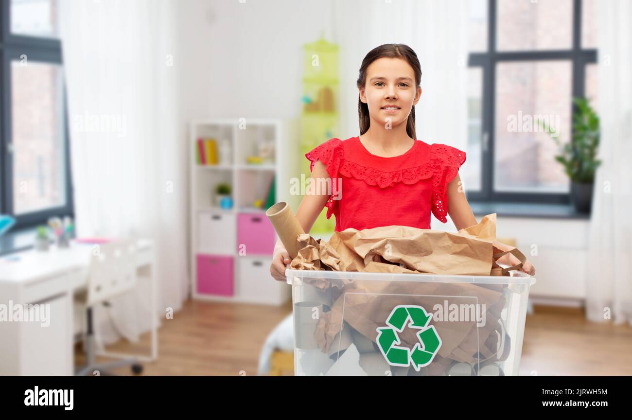 smiling girl sorting paper waste Stock Photo - Alamy
