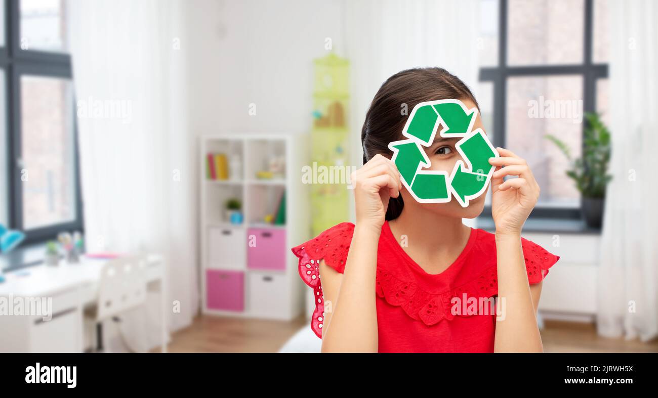 smiling girl holding green recycling sign Stock Photo - Alamy