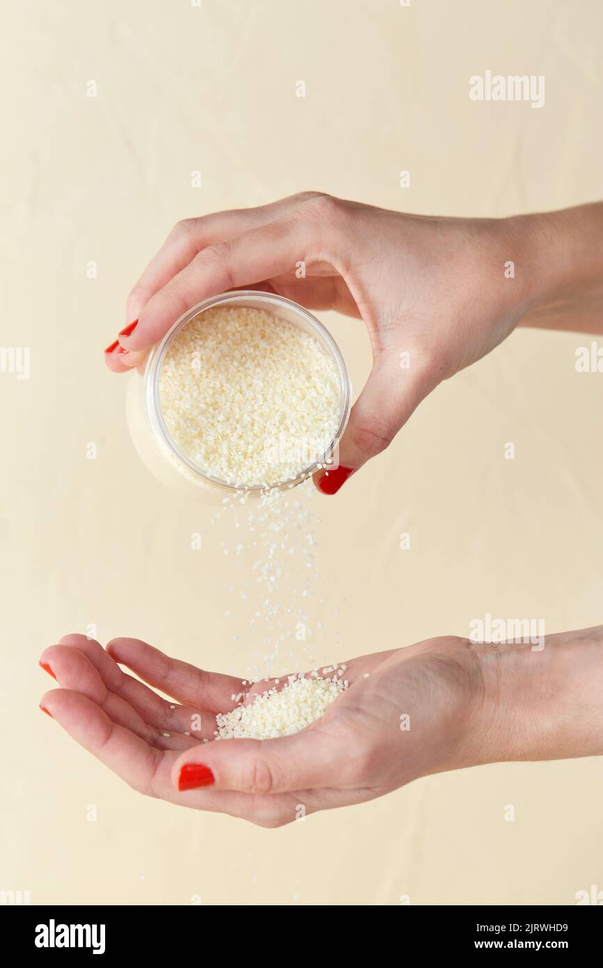 hands with bath salt in jar Stock Photo - Alamy