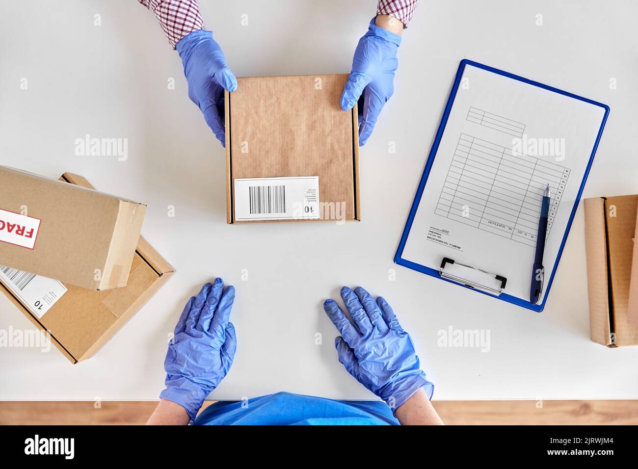 Hands giving parcel box customer hi-res stock photography and images ...