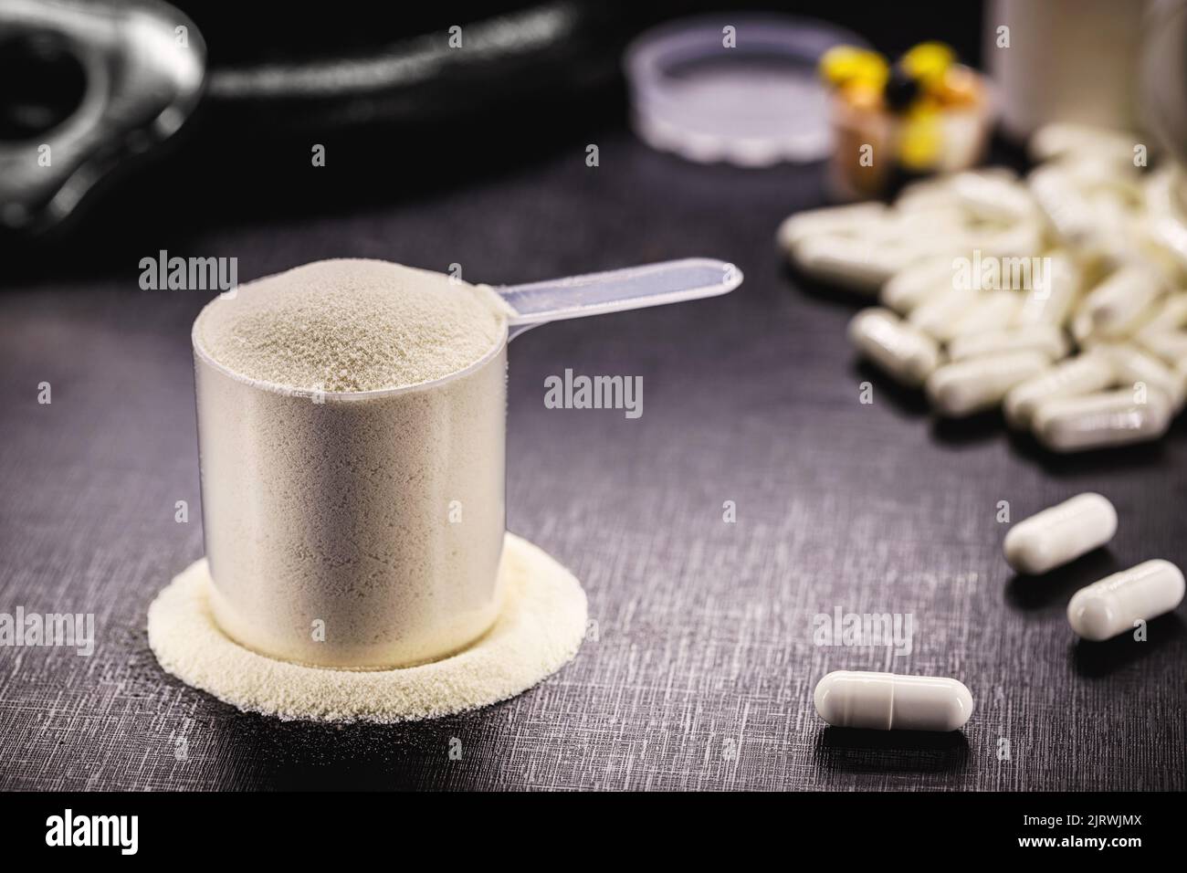 Measuring spoon with creatine or whey, and steroid pills, food ...