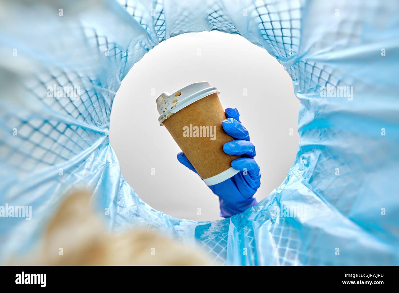 female doctor throwing coffee cup into trash can Stock Photo - Alamy