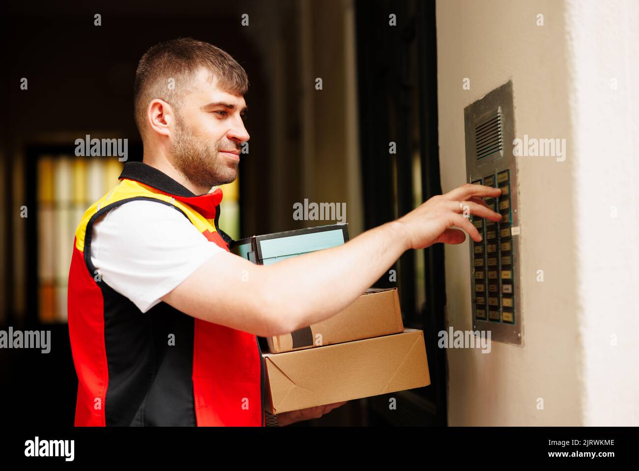 Young postman door bell hi-res stock photography and images - Alamy