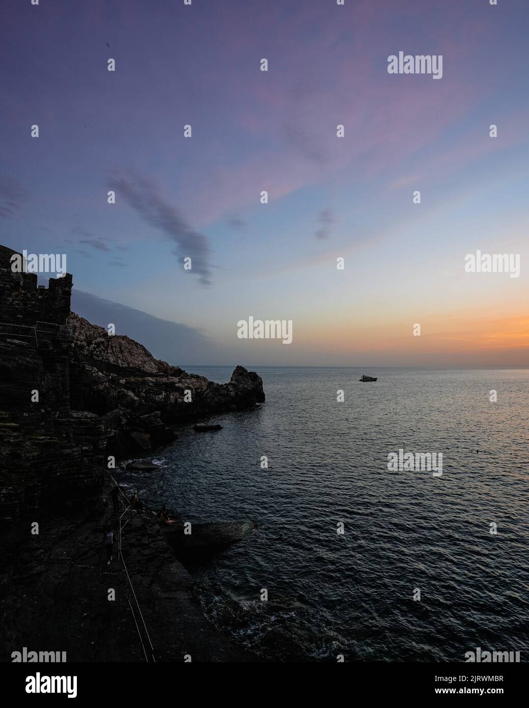 The Porto Venere town in Italy, with the Byron's cave and a boat in the ...