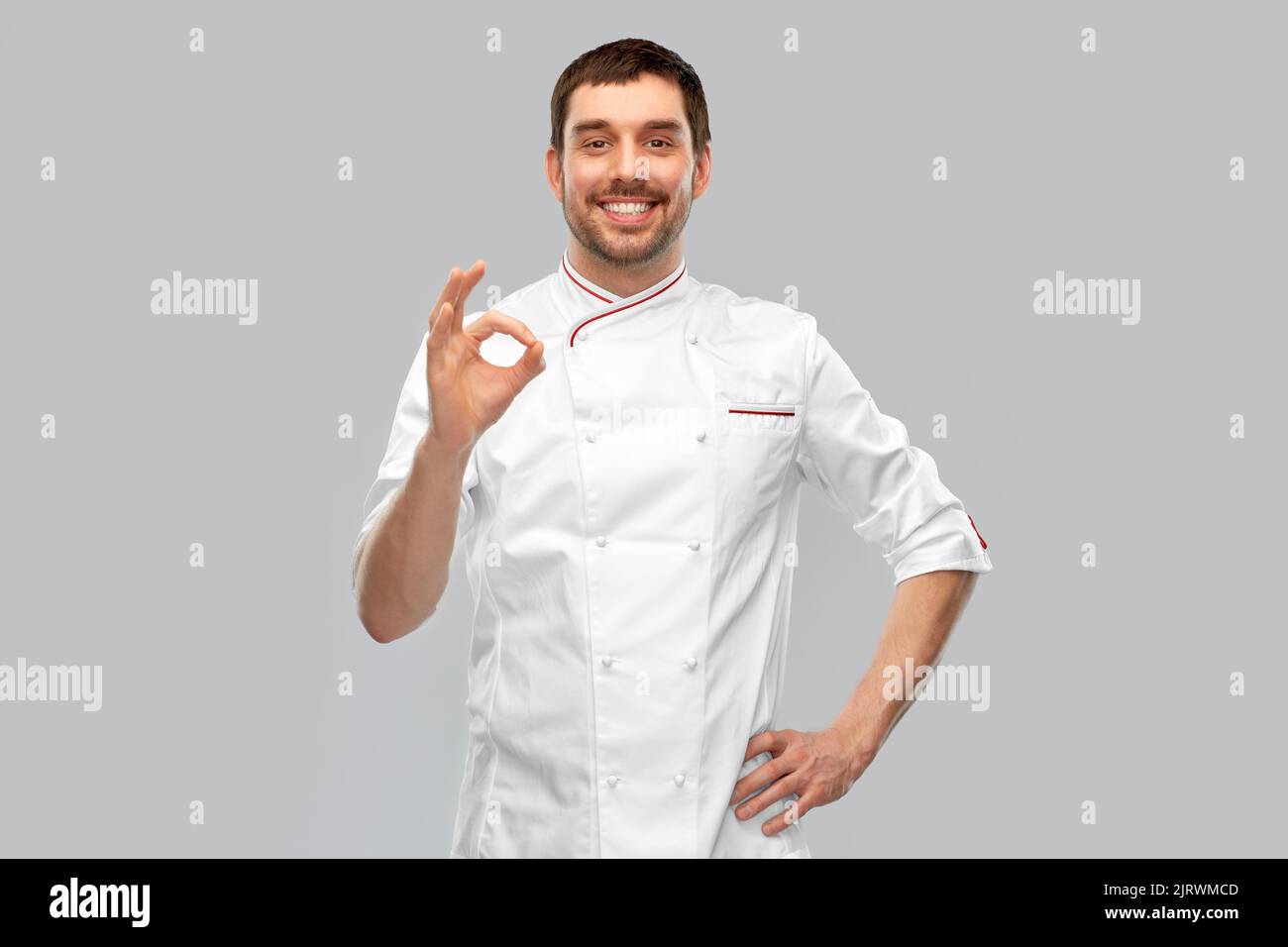 happy smiling male chef showing ok hand sign Stock Photo - Alamy