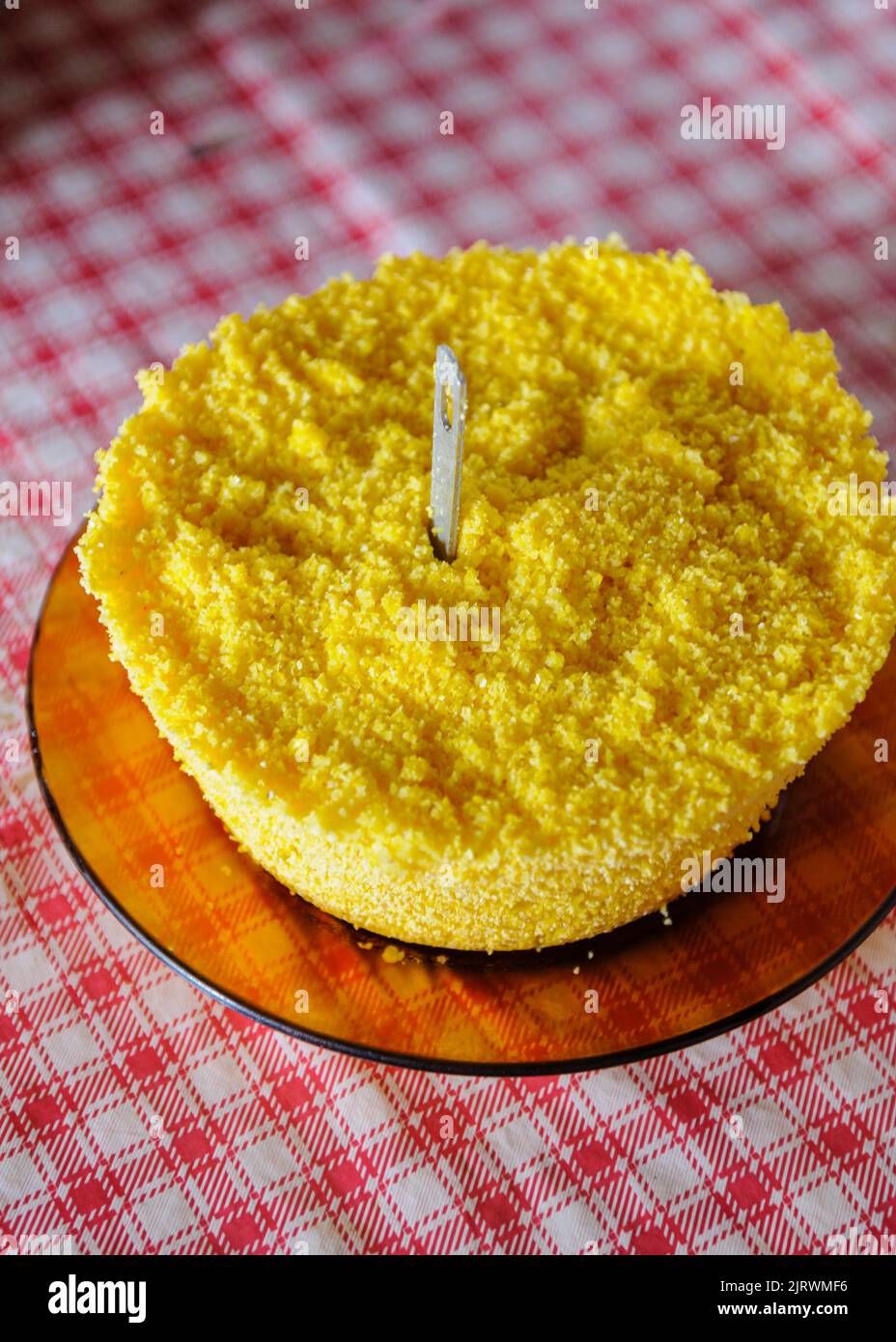 Corn couscous on table with red and white tablecloth. Popular dish from ...