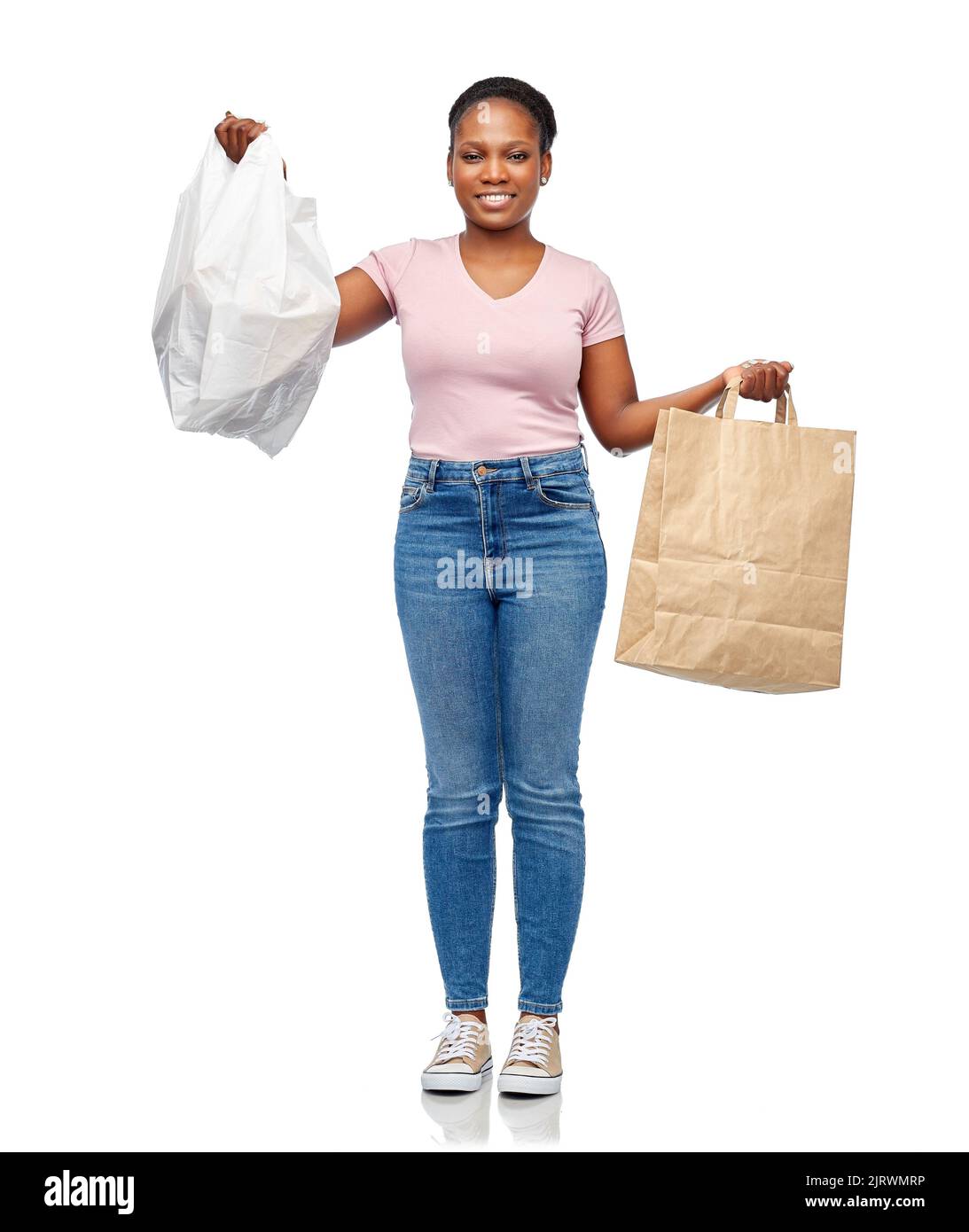 african woman comparing paper and plastic bags Stock Photo - Alamy