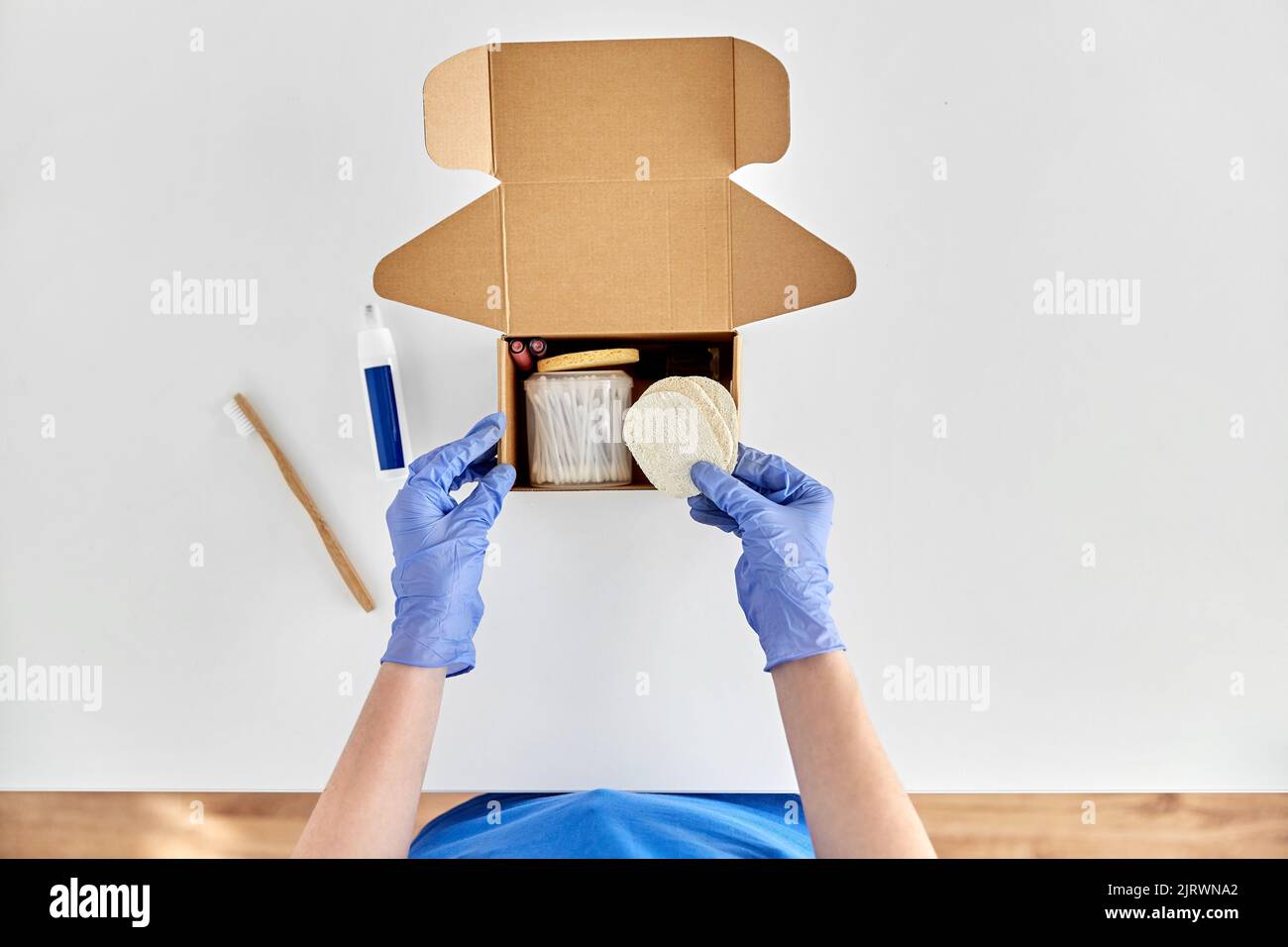 Hands in gloves packing parcel hi-res stock photography and images - Alamy