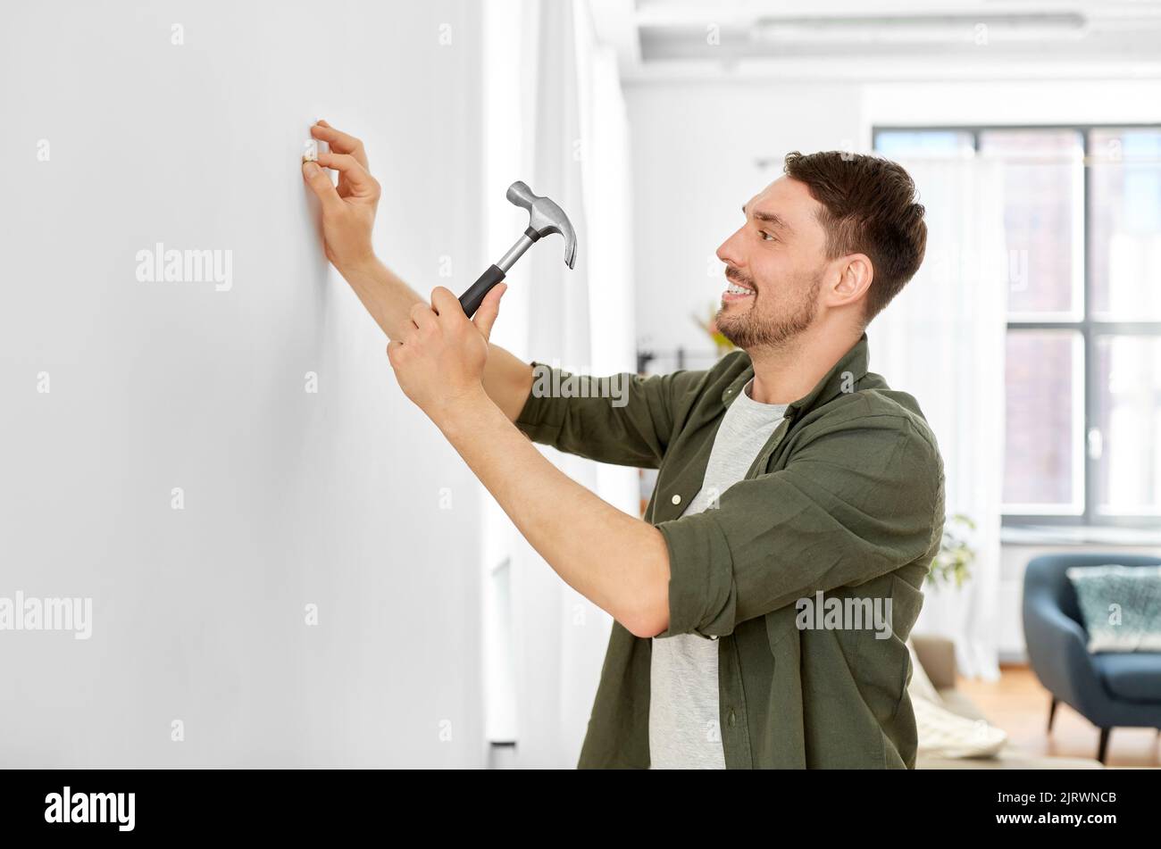 Hammer man wall hi-res stock photography and images - Alamy