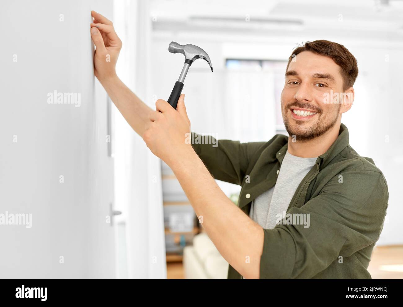 Hammer man wall hi-res stock photography and images - Alamy