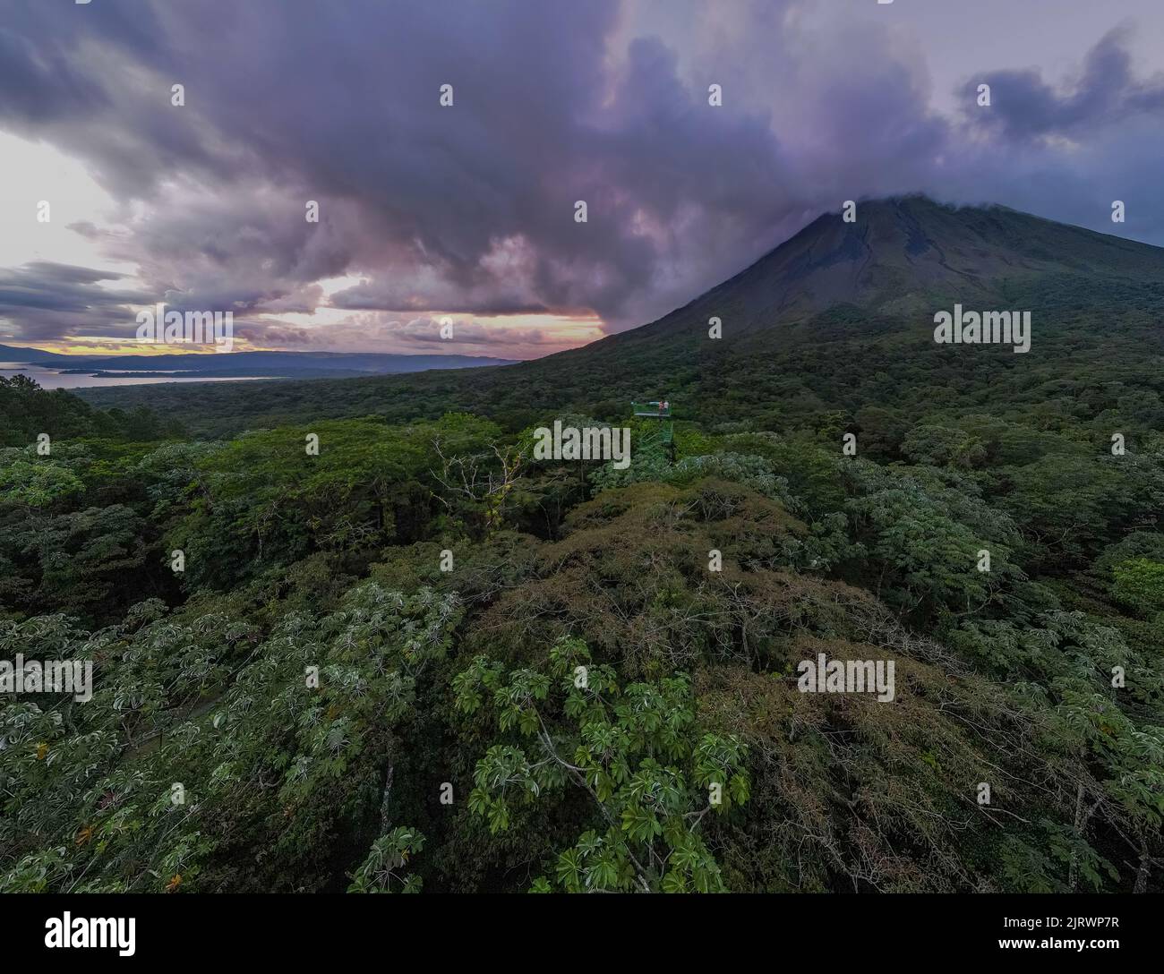 Beautiful aerial lview of Arenal Volcano, the arenal Lagoon, and rain ...