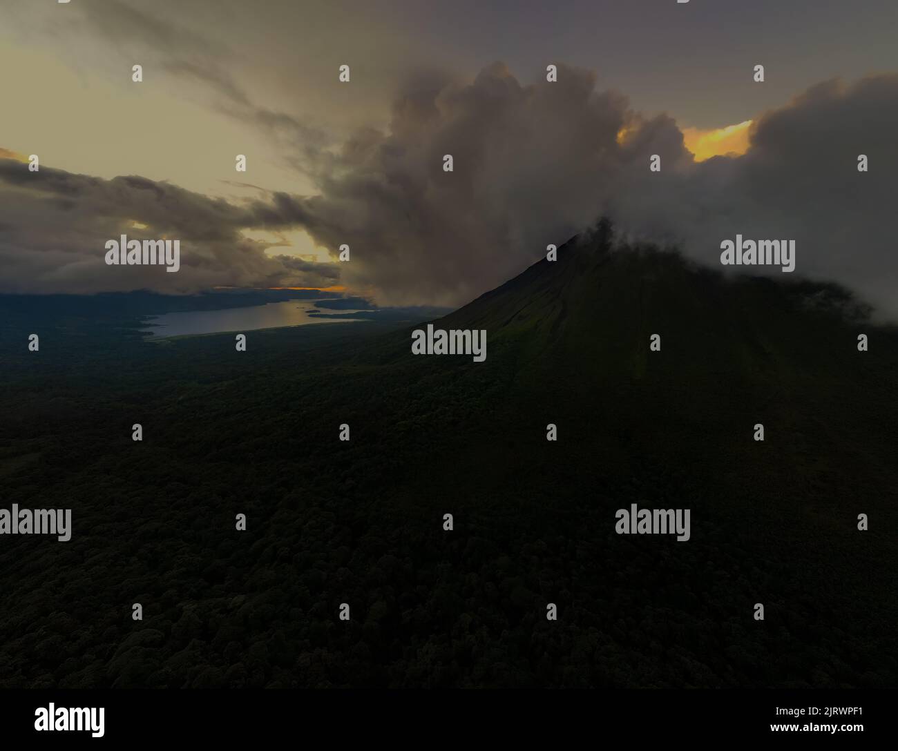 Beautiful aerial lview of Arenal Volcano, the arenal Lagoon, and rain ...