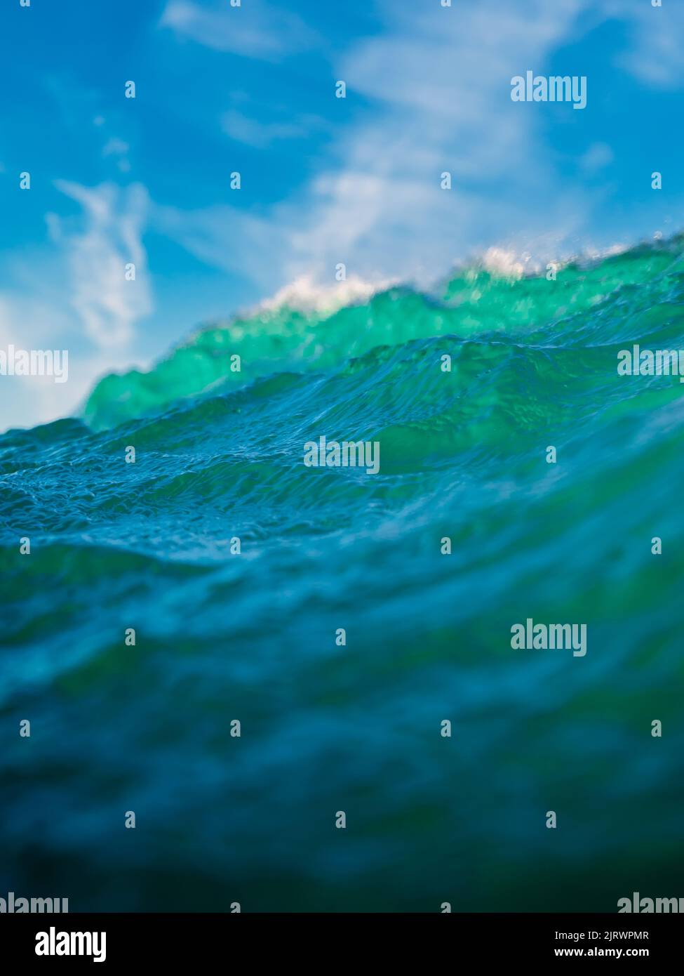 Breaking ocean wave with sun light. Liquid texture of water Stock Photo ...