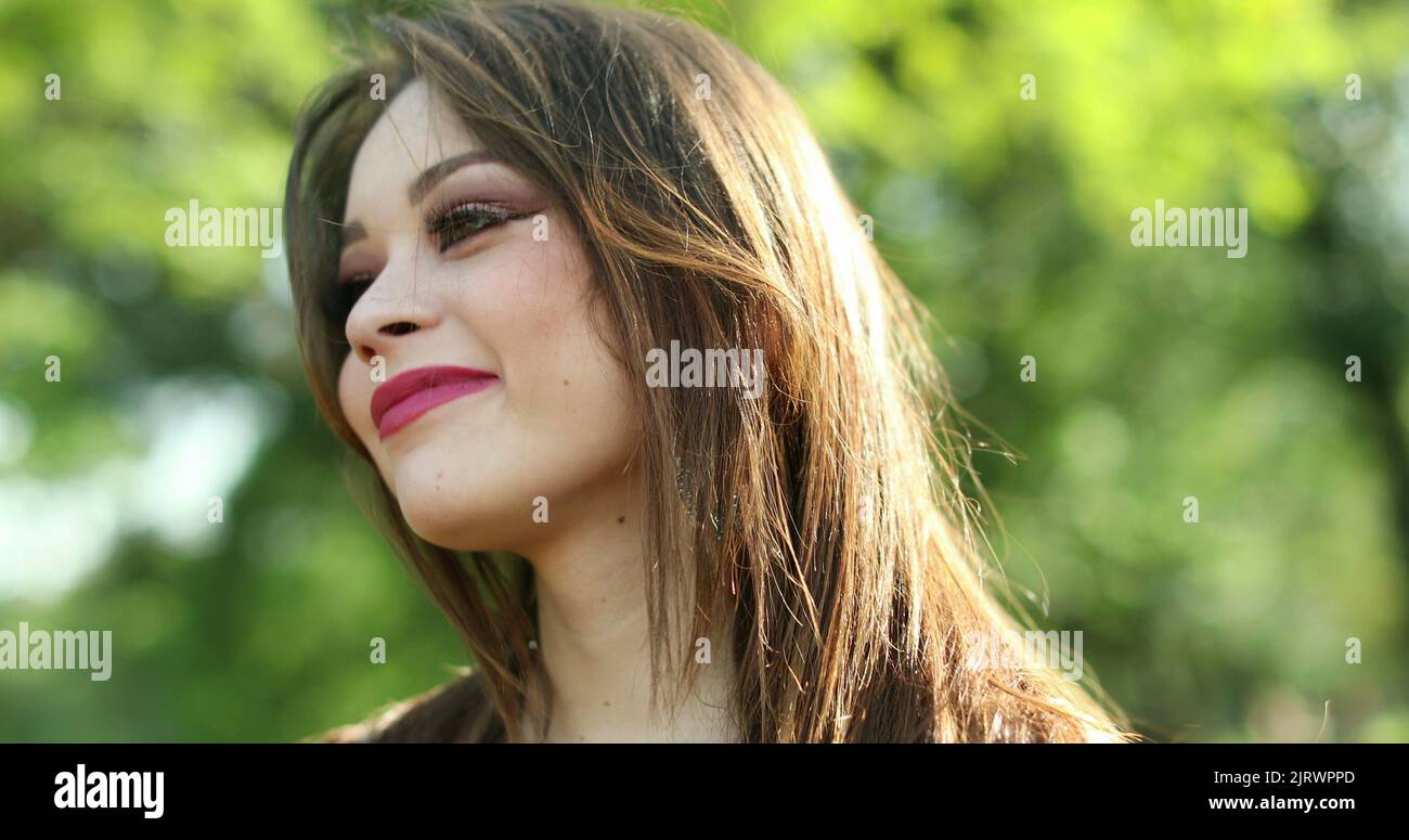 Happy young woman nodding yes with head in outdoor park. Pretty girl ...