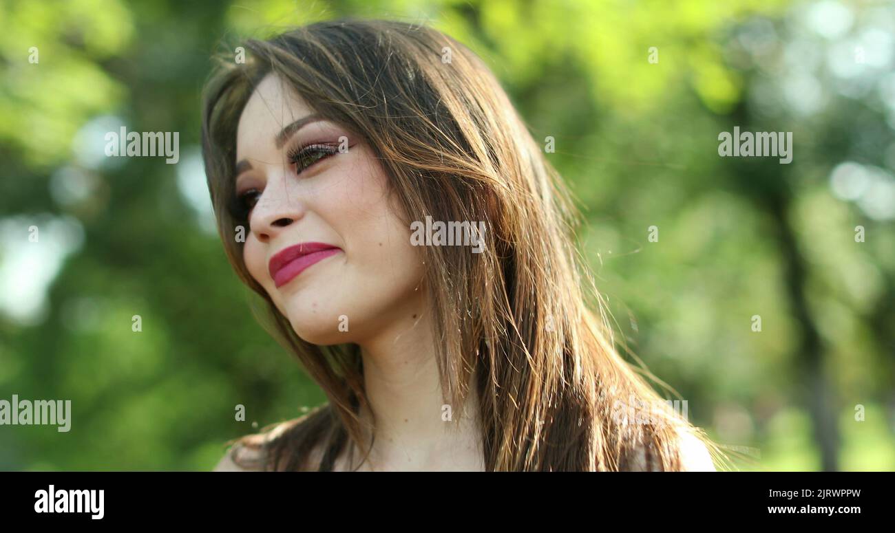 Happy young woman nodding yes with head in outdoor park. Pretty girl ...