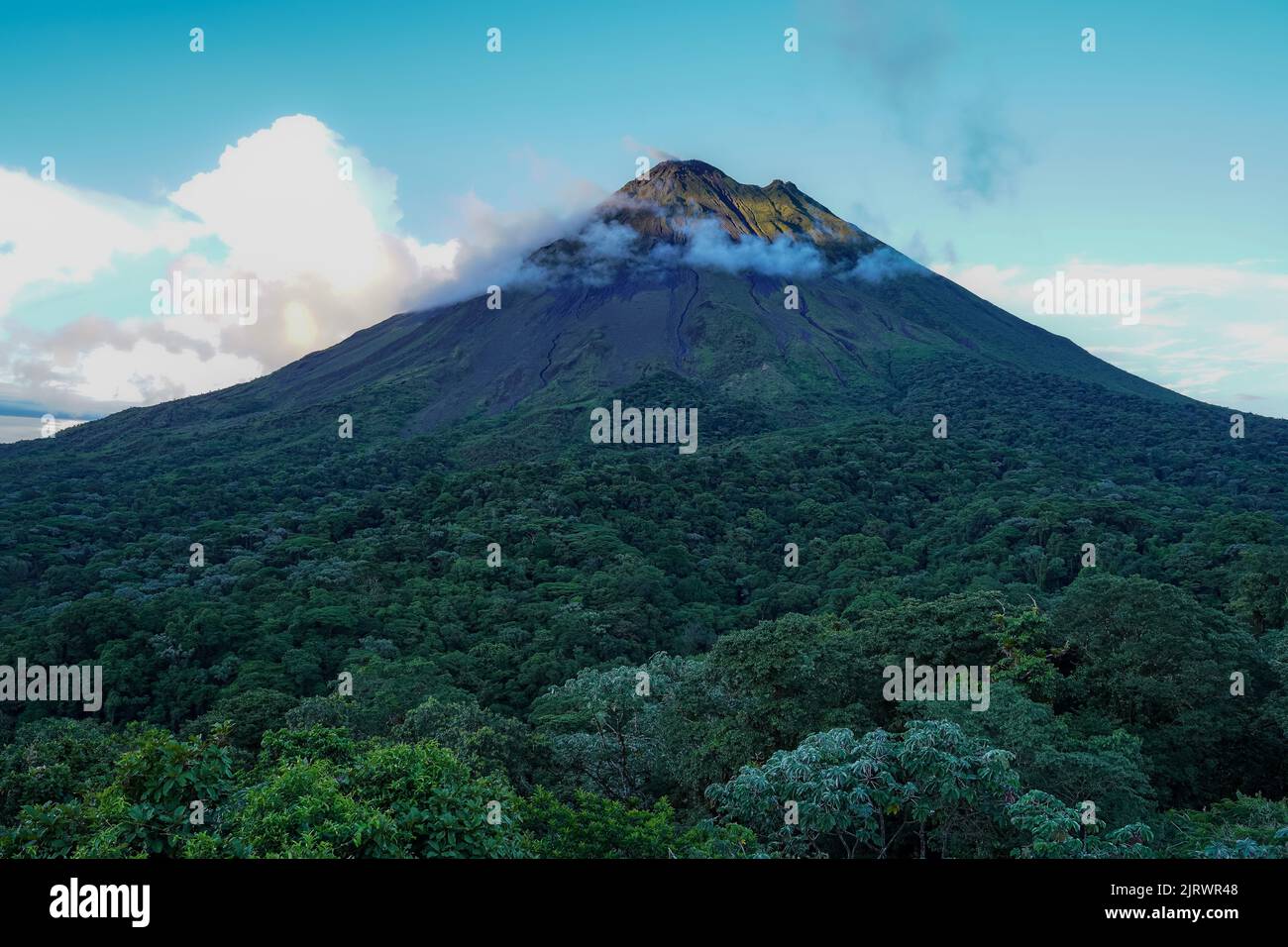 Beautiful aerial lview of Arenal Volcano, the arenal Lagoon, and rain ...