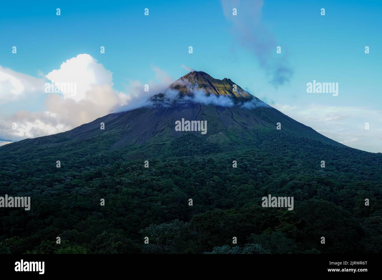 Beautiful aerial lview of Arenal Volcano, the arenal Lagoon, and rain ...