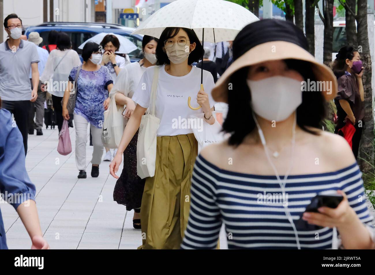 Pedestrians wearing face masks as a preventive measure against the ...