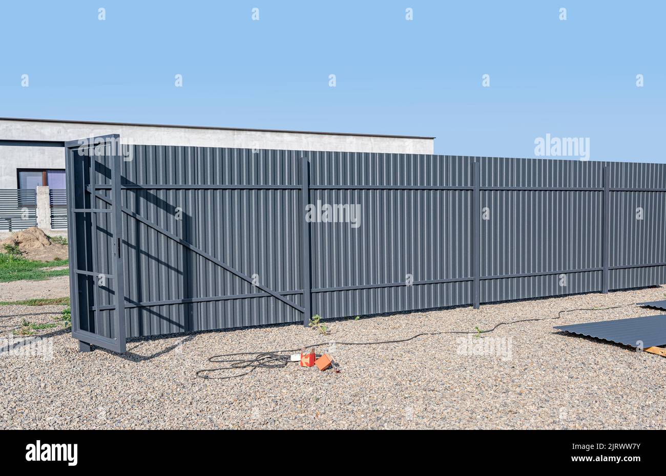 Installation of metal gates Stock Photo - Alamy