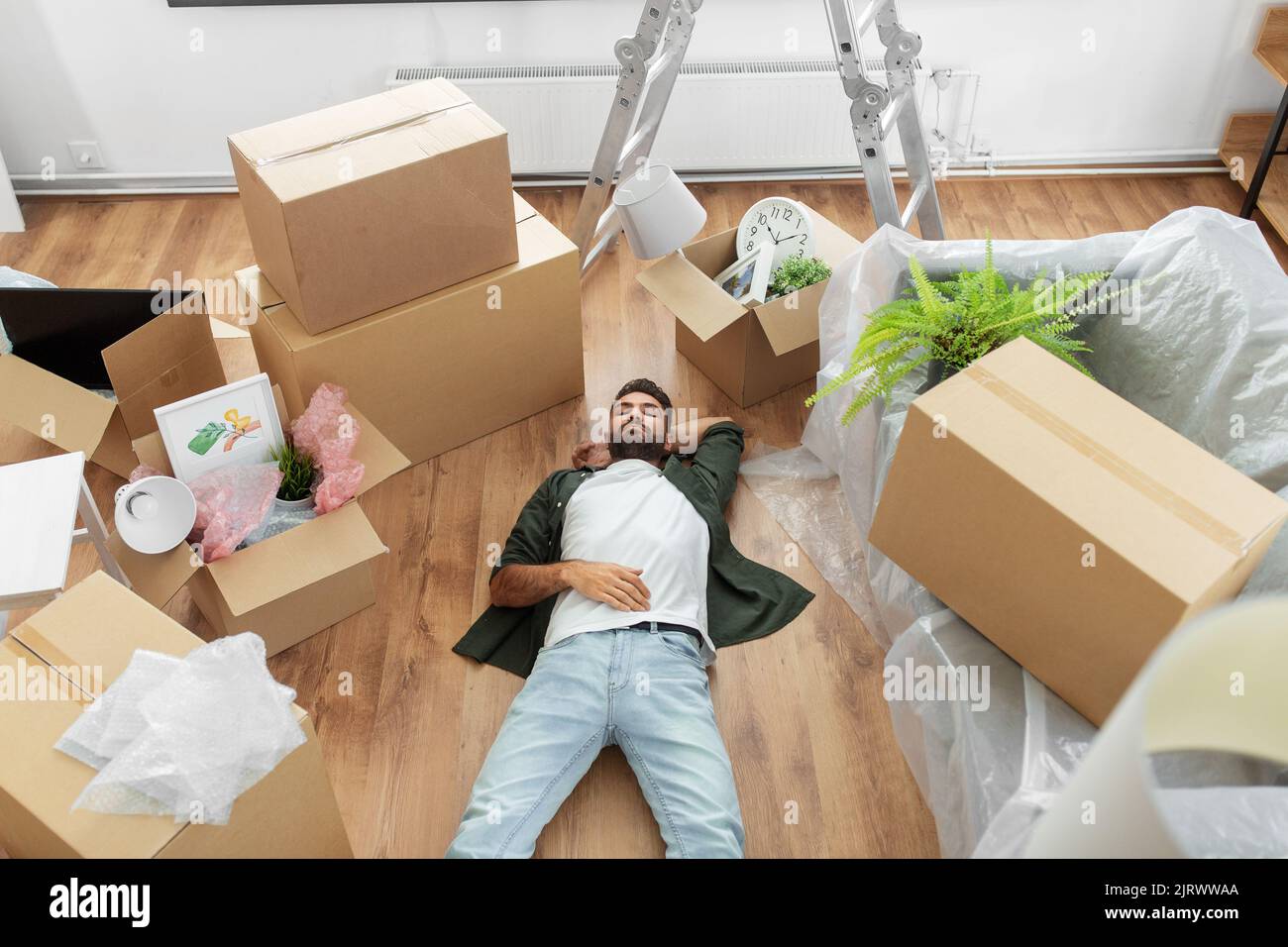 man with boxes moving to new home Stock Photo - Alamy