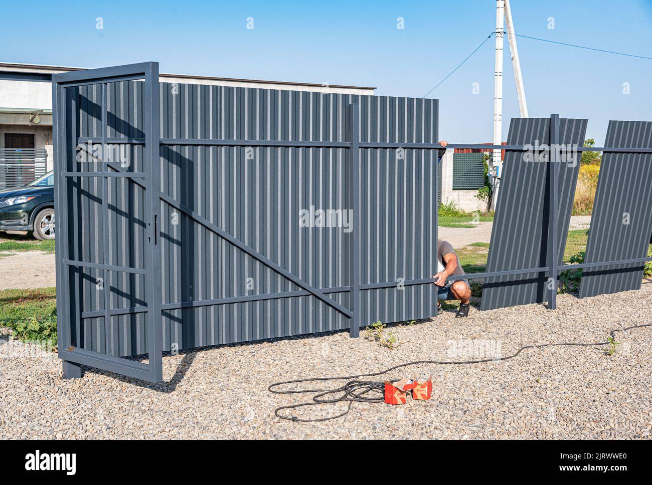 Installation of metal gates Stock Photo - Alamy
