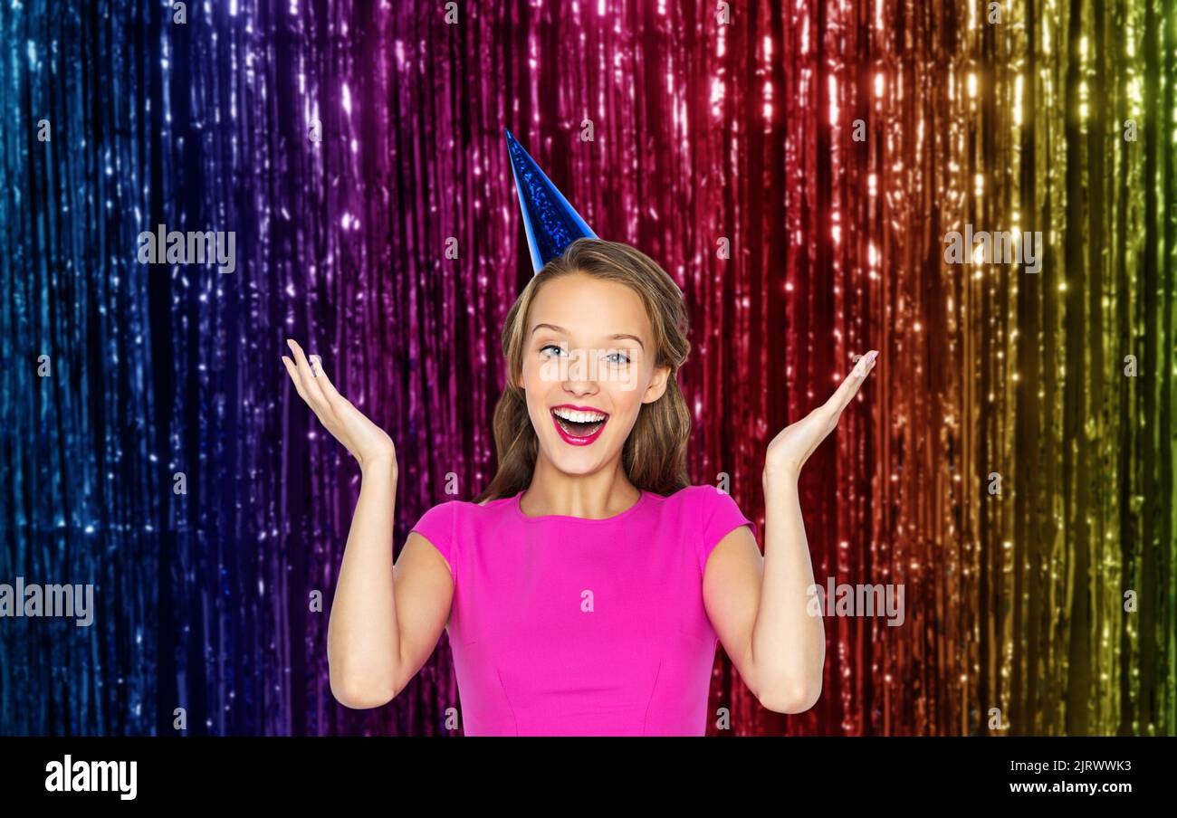 happy young woman or teen girl in party cap Stock Photo - Alamy