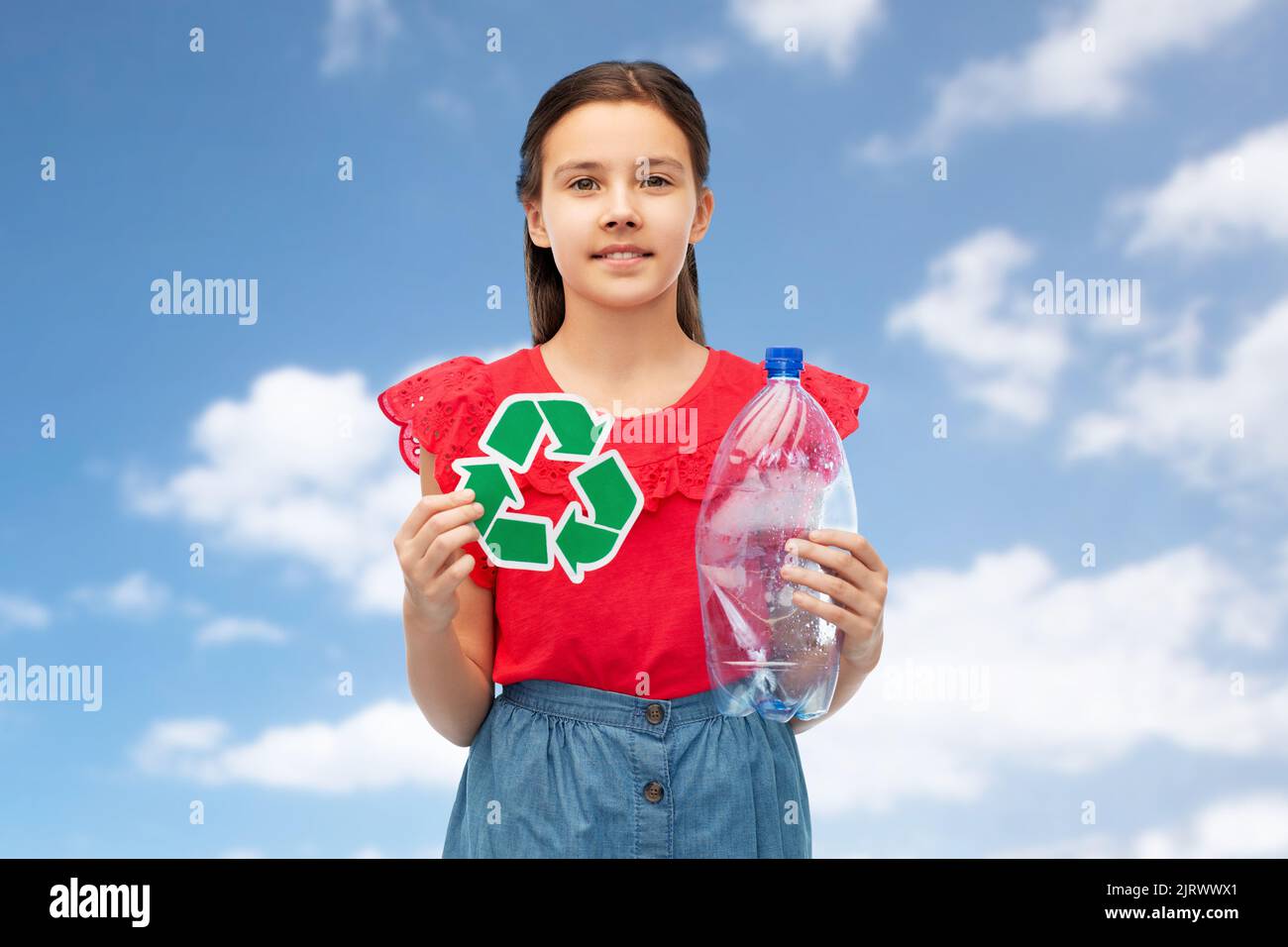 girl with green recycling sign and plastic bottle Stock Photo - Alamy