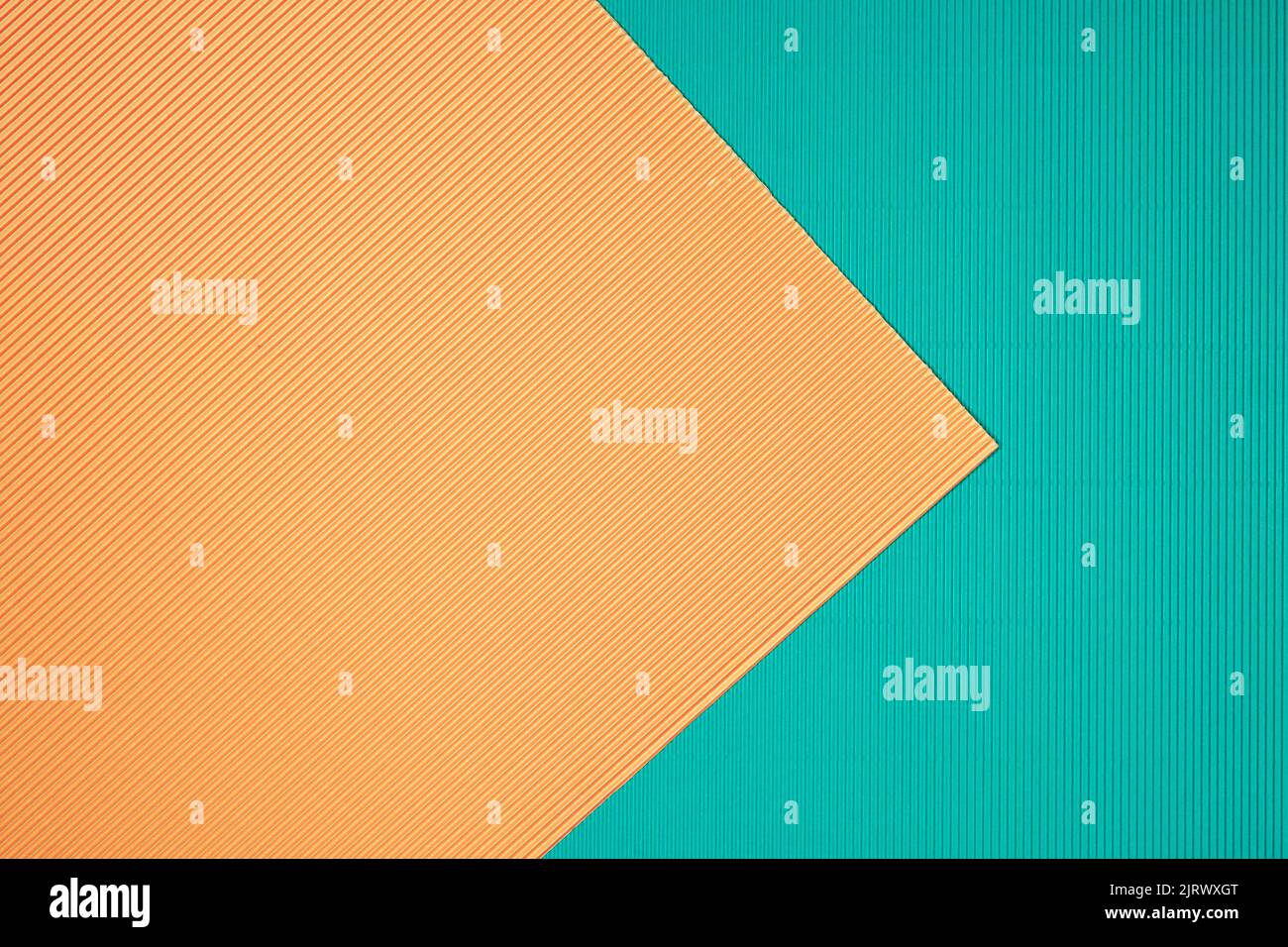 Turqoise and orange two tone color paper background with stripes ...