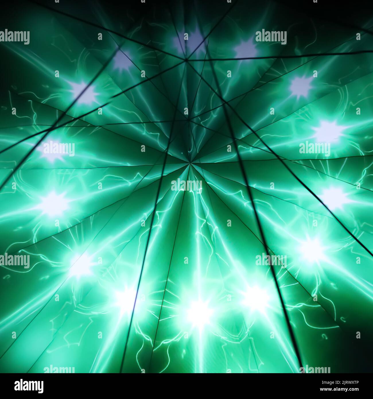 Laser projection of bright glowing turquoise rays with stars Stock ...