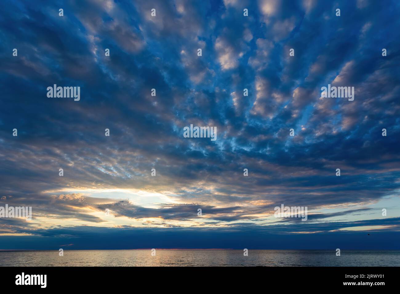 A cloudy beautiful sunset captured over Lake Huron in Grand Bend ...