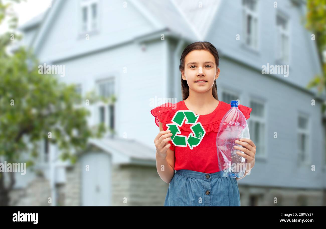 girl with green recycling sign and plastic bottle Stock Photo - Alamy